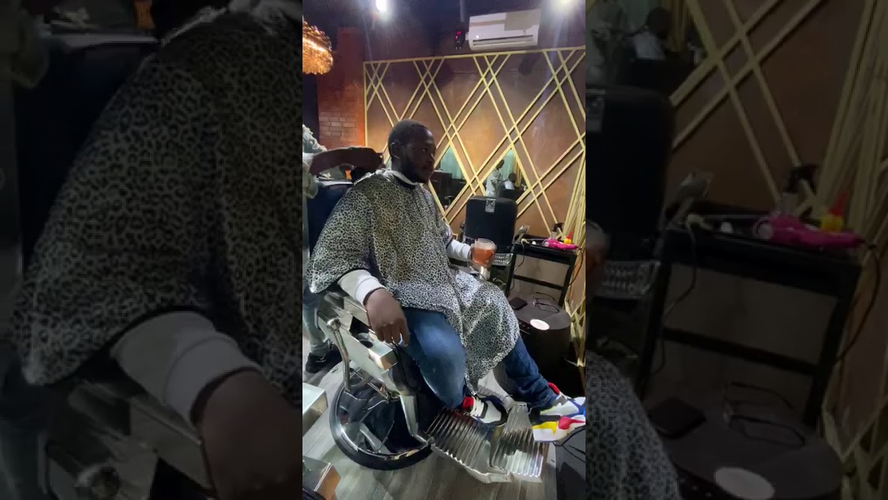 Kenyan barber - YouTube