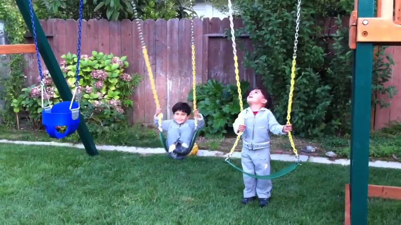 Kid in swing falling off - YouTube
