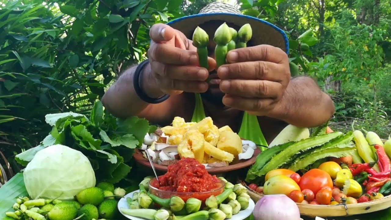 Raw moonflower beans, Mustard leaves and cassava with chili salt sauce ...