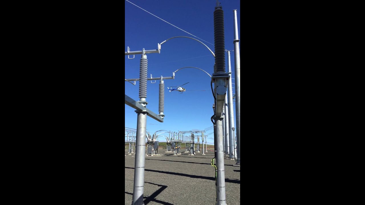Helicopter Stringing High Voltage Conductor in Electrical Sub Station ...