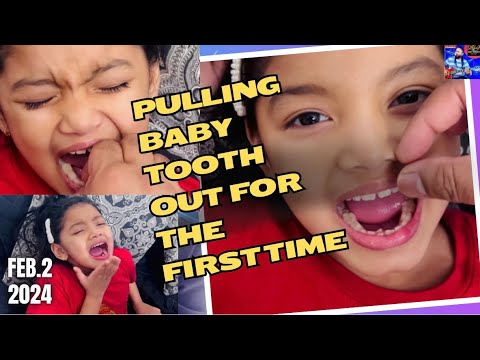 Baby tooth pulling out for the first time - YouTube