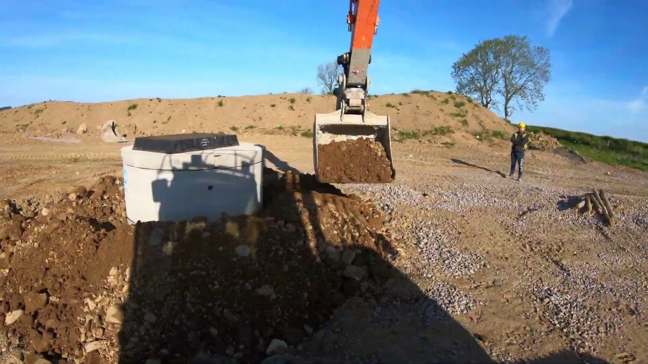 How to build a raised manhole with a 13 ton digger, in time warp mode ...