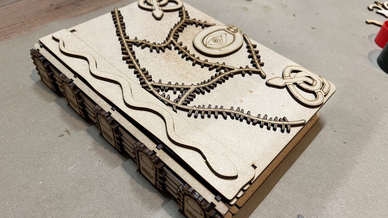 Tutorial - Assembling Hocus Pocus lasercut book - YouTube