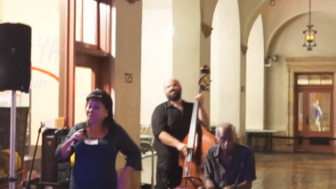 Tommy James and Alika Lyman performing at a downtown Christmas party ...