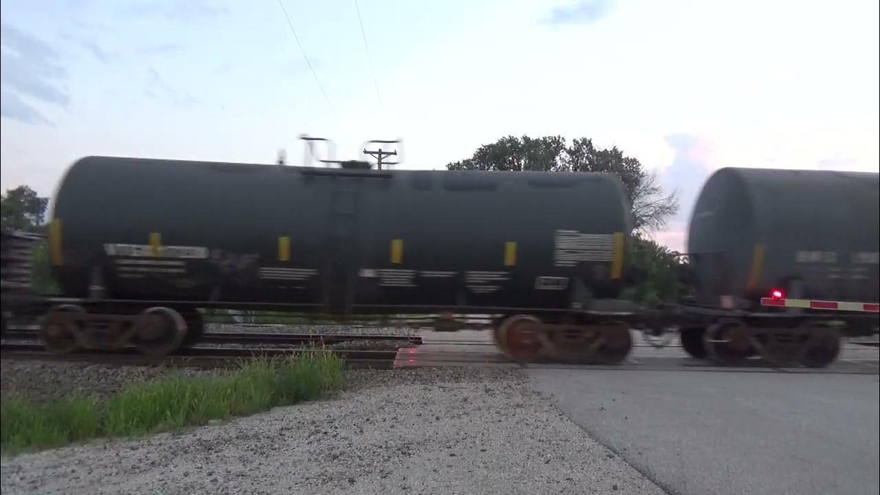 BNSF 5144 leads a manifest train off the Napier Sub at Pacific Junction, Iowa. - YouTube