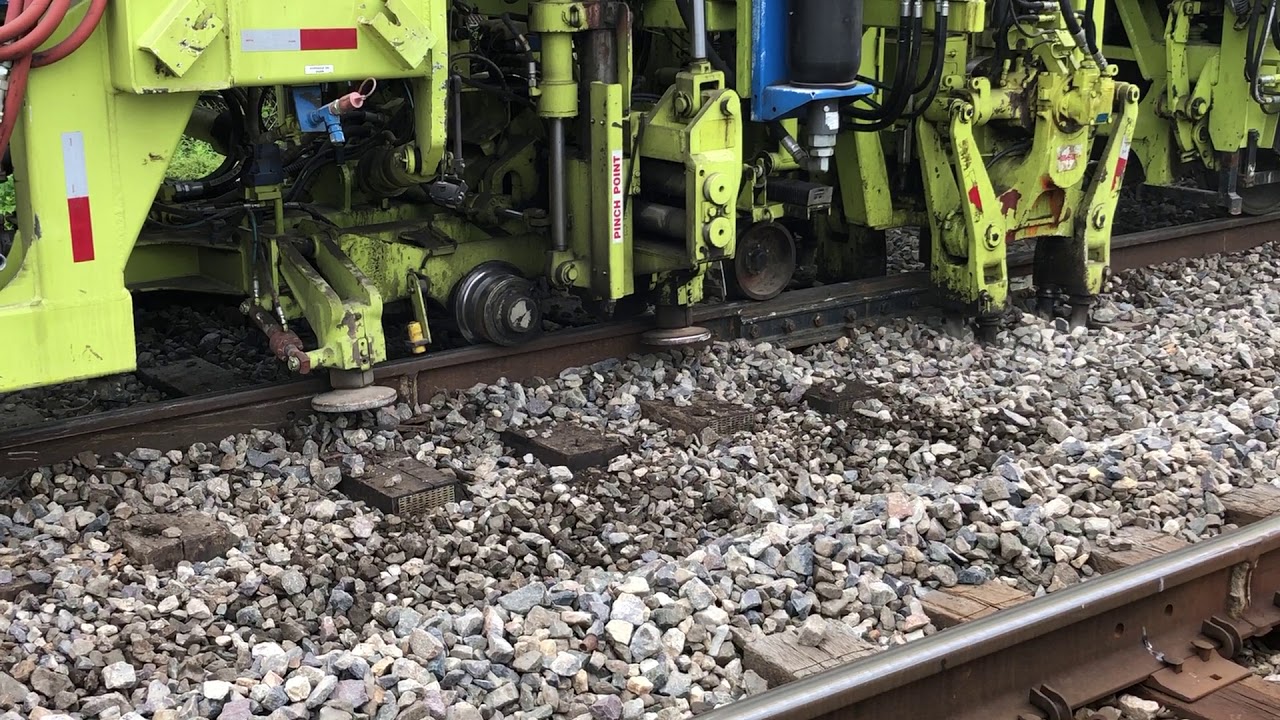 Railroad tie replacement: tamping - YouTube