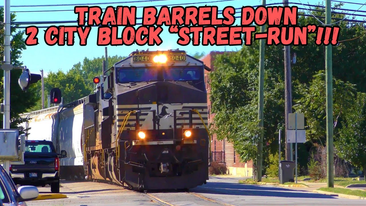 FAST STREET-RUNNING TRAIN "2" city blocks in the middle of a very busy ...