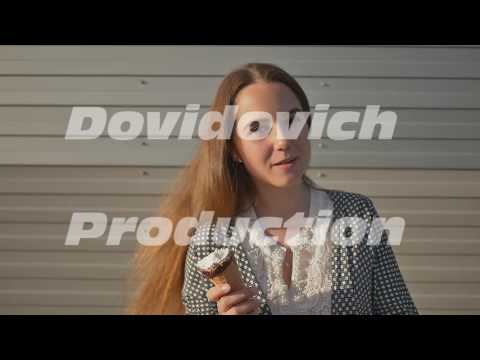 Young teen girl eating a delicious pistachio ice cream on a striped gray background