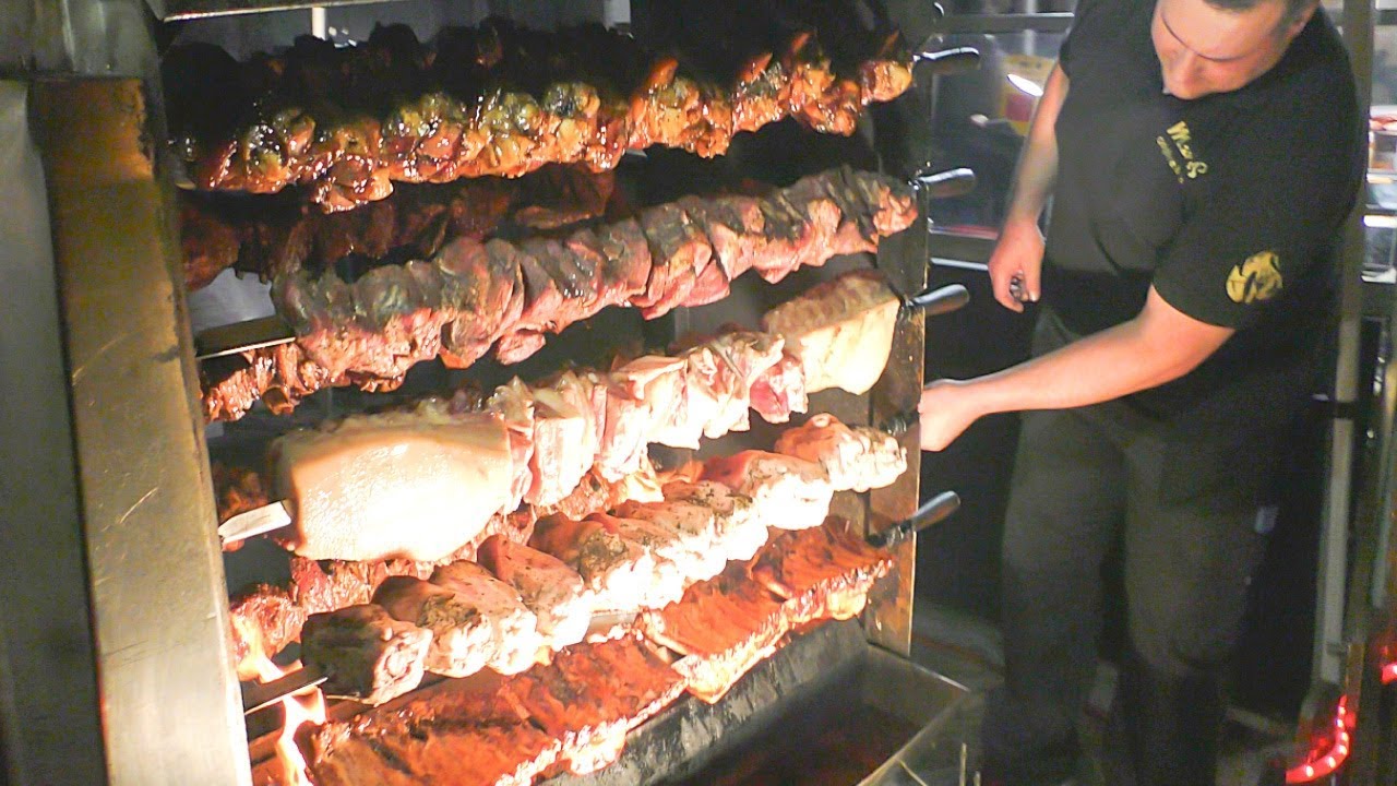 Germany Street Food. Huge Swords of Pork Knuckles and Mixed Meat on ...