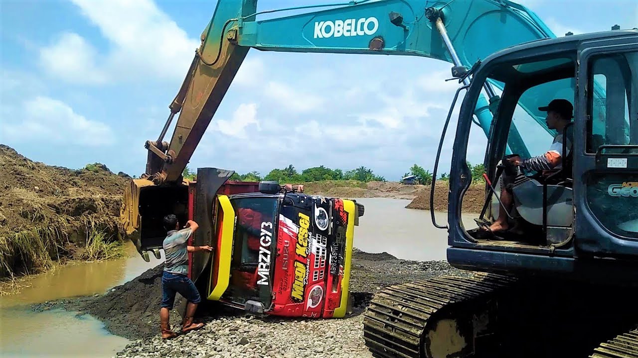 Overloaded Dump Truck Stuck Tip Over Excavator Heavy Recovery Kobelco ...
