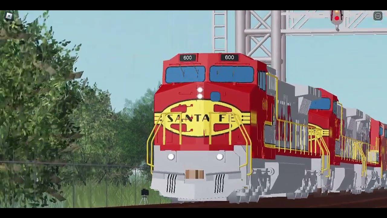 Santa Fe 600 leads a very long loaded grain train heading to Kansas! and drops down the signal ...