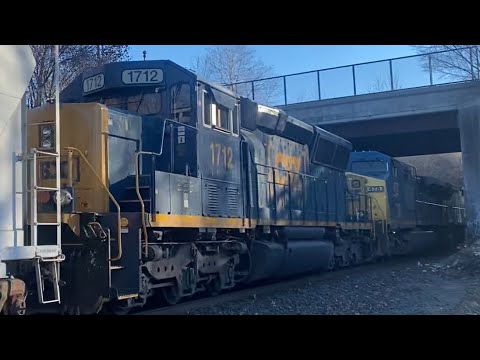 CSX M426 goes at a good pace thru CP57 with CSX SD40E3 1712 trailing ...