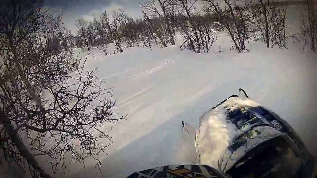 Snowmobiling in deep powder - YouTube