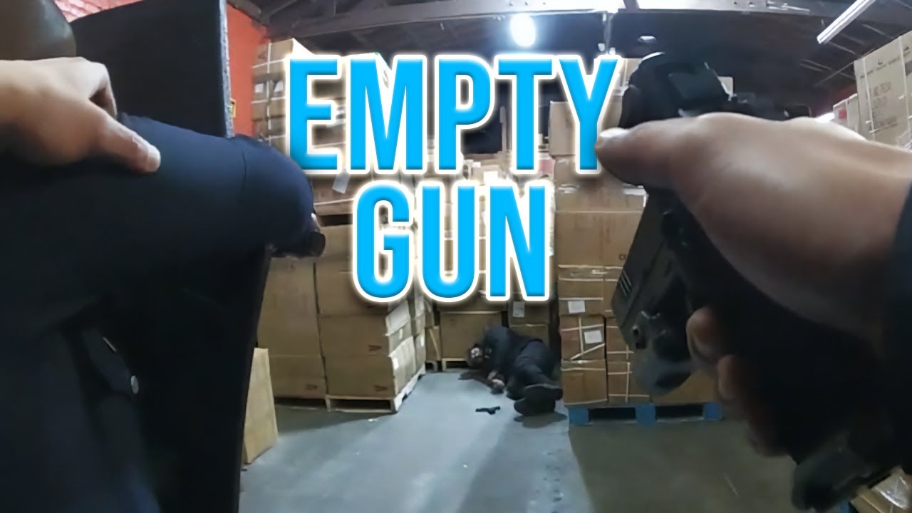 Suspect Pulls Empty Gun On Room Full Of Cops - YouTube