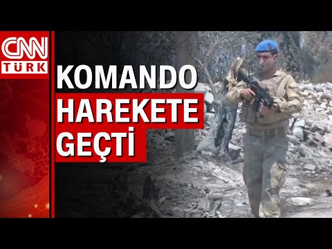 Kahraman Türk komandosu yangın bölgesinde afetzedede yardım ediyor