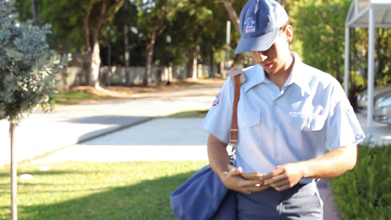 mailman walking along street delivering letters - YouTube