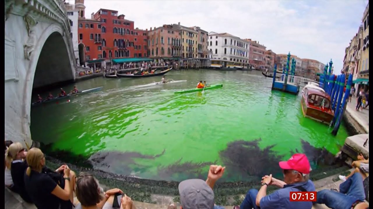 Venice canal patch turns fluorescent green (Italy) - YouTube