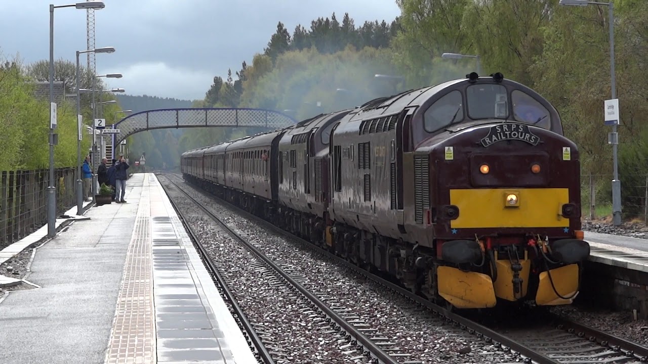 WCR 37685 (Loch Arkaig) and 37516 (Loch Laidon) pass through Carrbridge ...