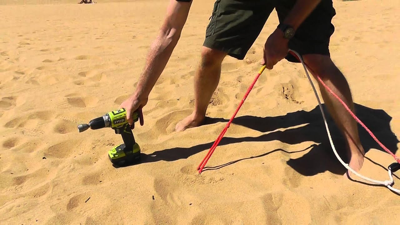 Large plastic Peggy Peg screwed into soft sand - YouTube