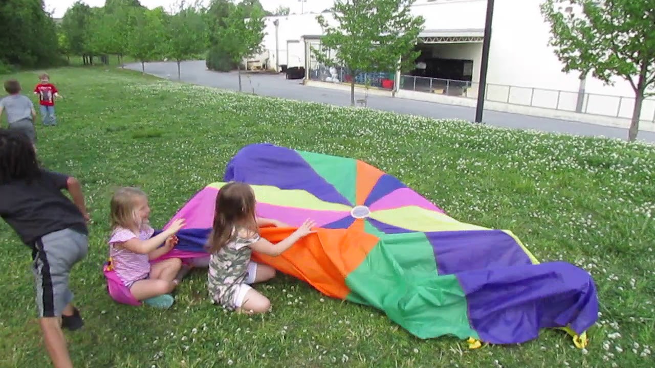 Playing under the parachute. - YouTube