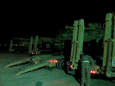 Offloading an M88 Hercules from a M1070 HET and M1000 Trailer - YouTube