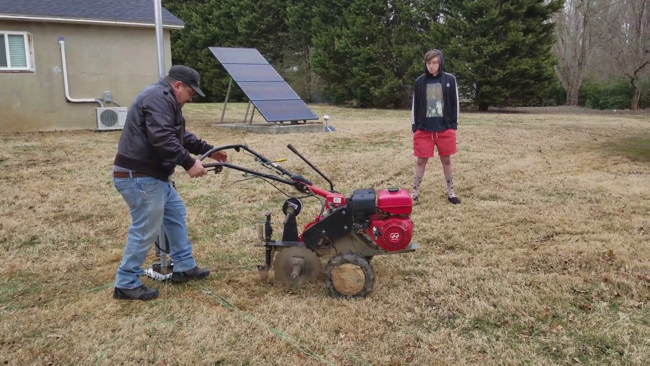 Trenching radial wires on a DX Engineering 43 foot vertical. - YouTube