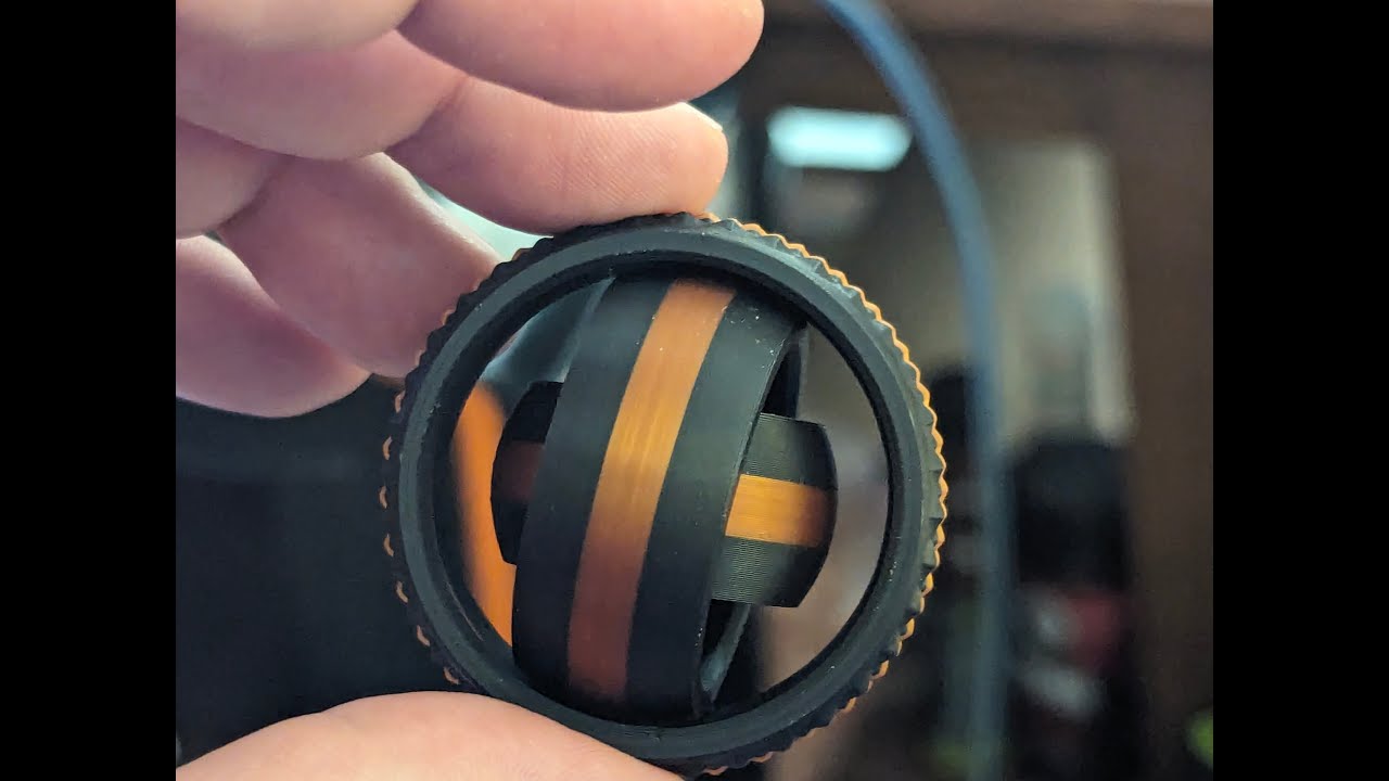 Slow Motion 3D Printed 3-Ring Micro Gyro Fidget Spinner - YouTube
