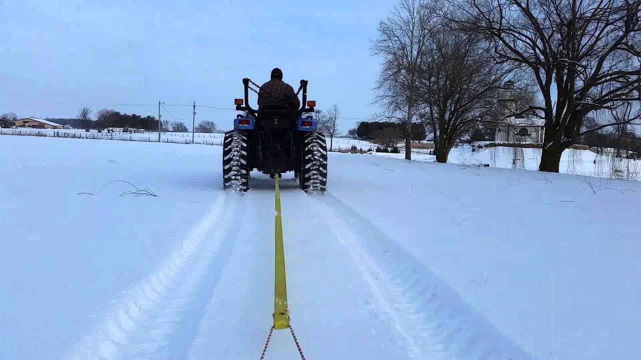 Sledding behind tractor - YouTube