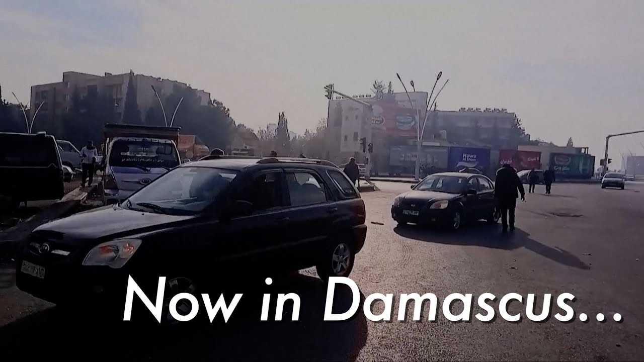 Opposition flag raised over Damascus, military clothes seen in street ...