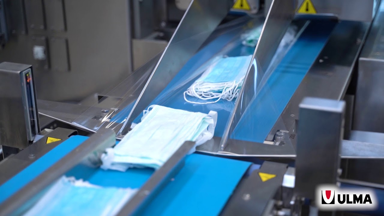 Medical face masks packaging in FM 205 flow pack wrapper - YouTube