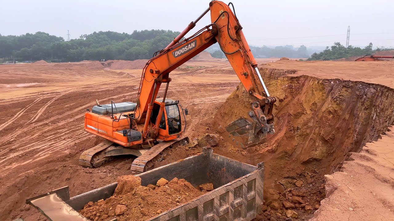 Giant Excavators Loading Soil On Trucks in Construction Site - JCB ...