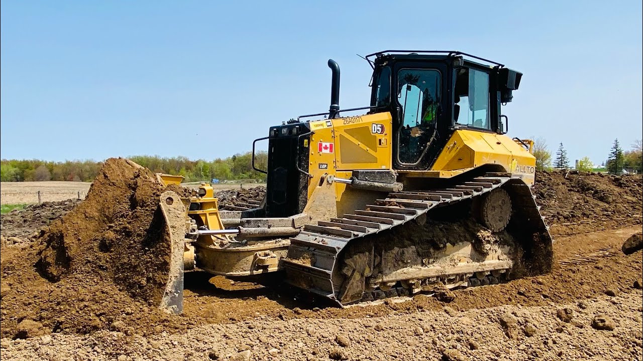 CAT D5 Next Gen dozer pushing fill. - YouTube