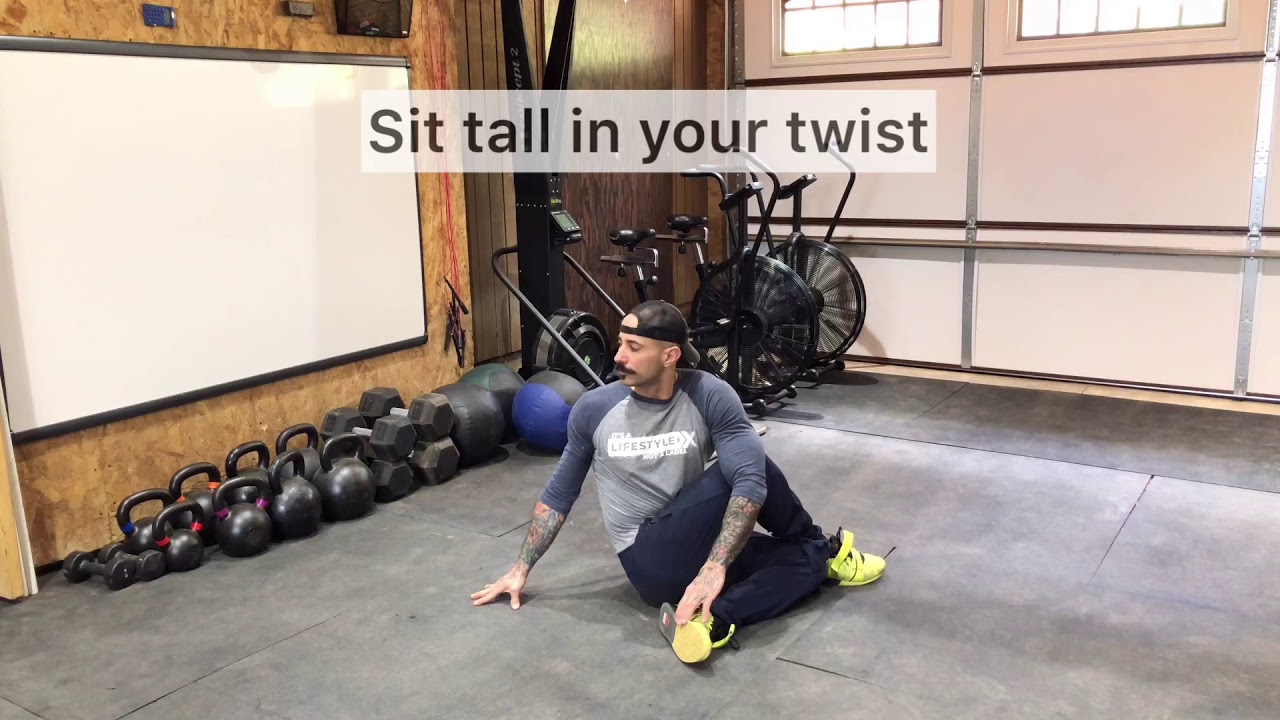 Seated Cross Legged Spinal Twist - YouTube