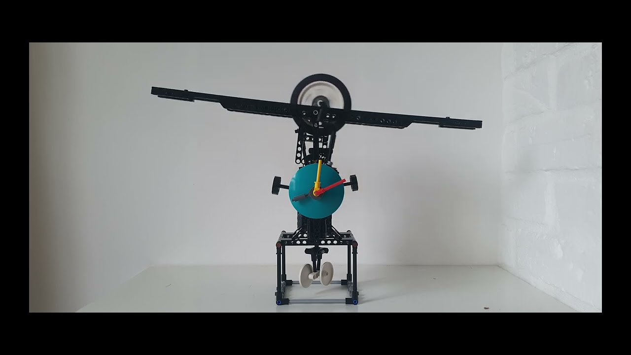 Rolling Pendulum Clock - YouTube