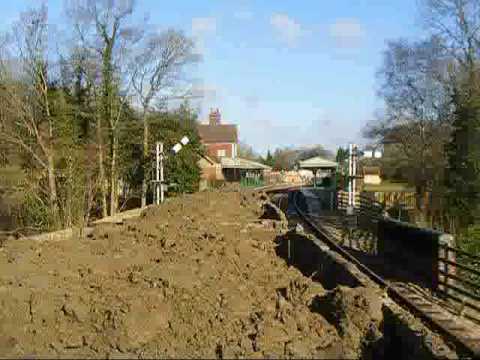 Bluebell Railway - A laden spoil train passes through Kingscote Station ...
