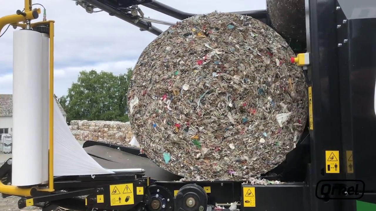 Baling reject from recycled paper with the Orkel Dens-X Compactor - YouTube
