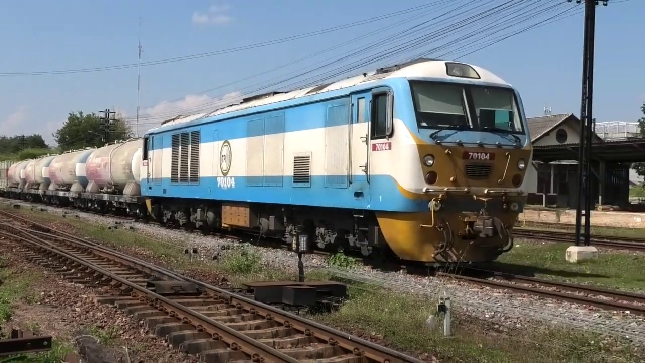 Cement freight train & Japanese railcar switching at Lampang station ...
