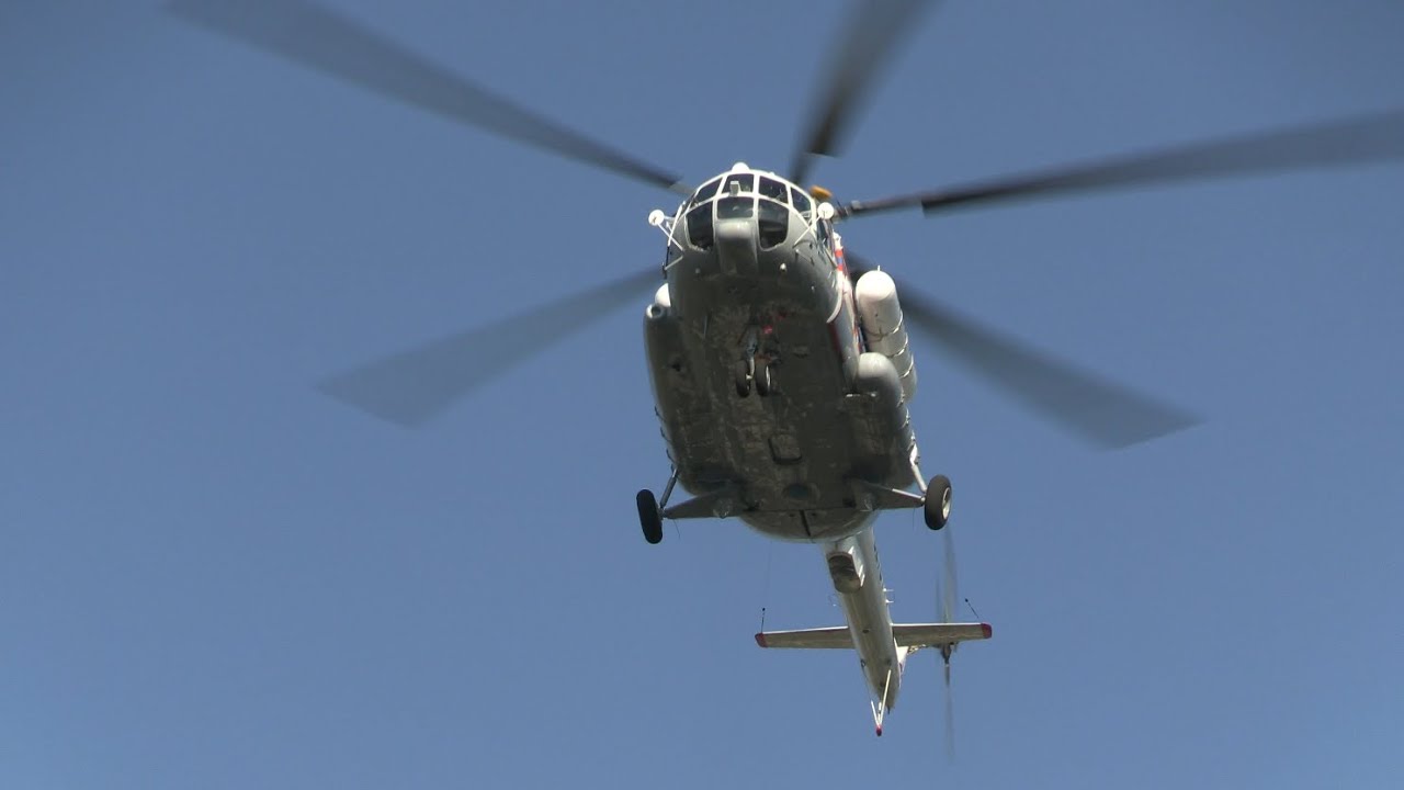 The helicopter of the Ministry of Emergency Situations flies to work ...