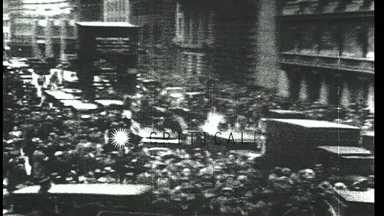 A crowd gathers outside the NYSE at Wall Street after an announcement ...