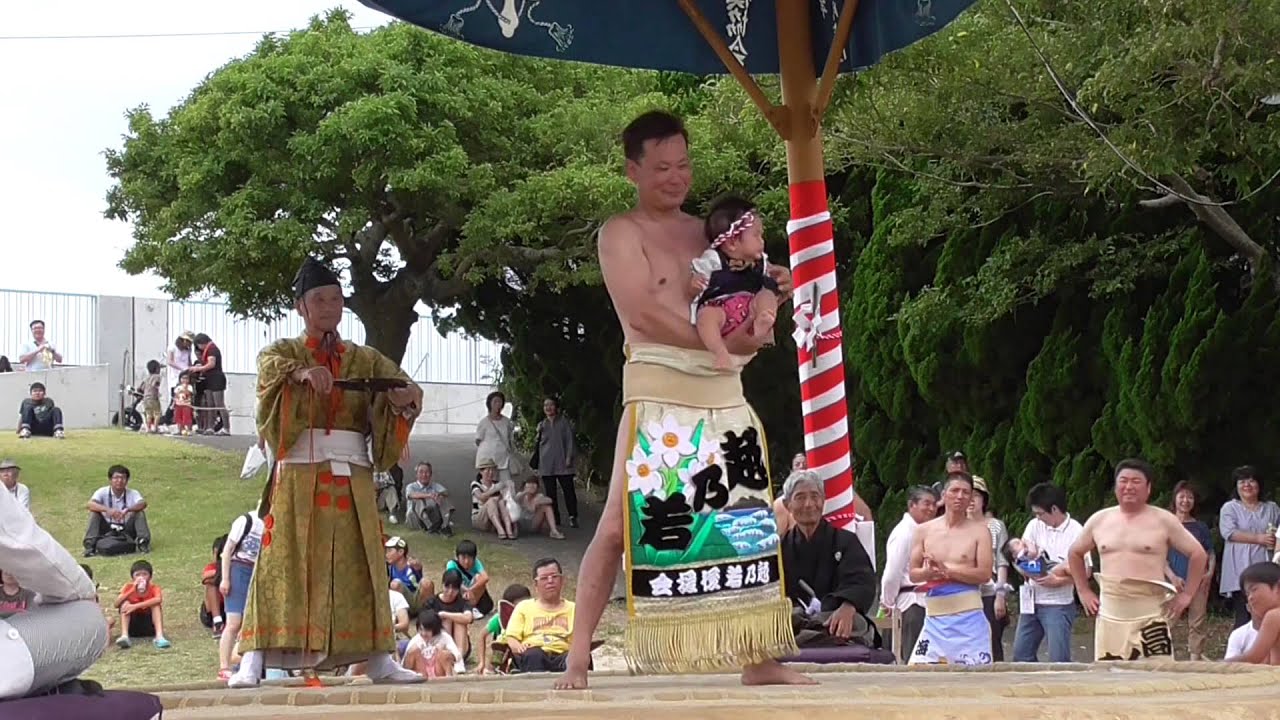 Children sumo wrestler's ceremonial into the ring at TAKAHAMA HACHIMAN ...