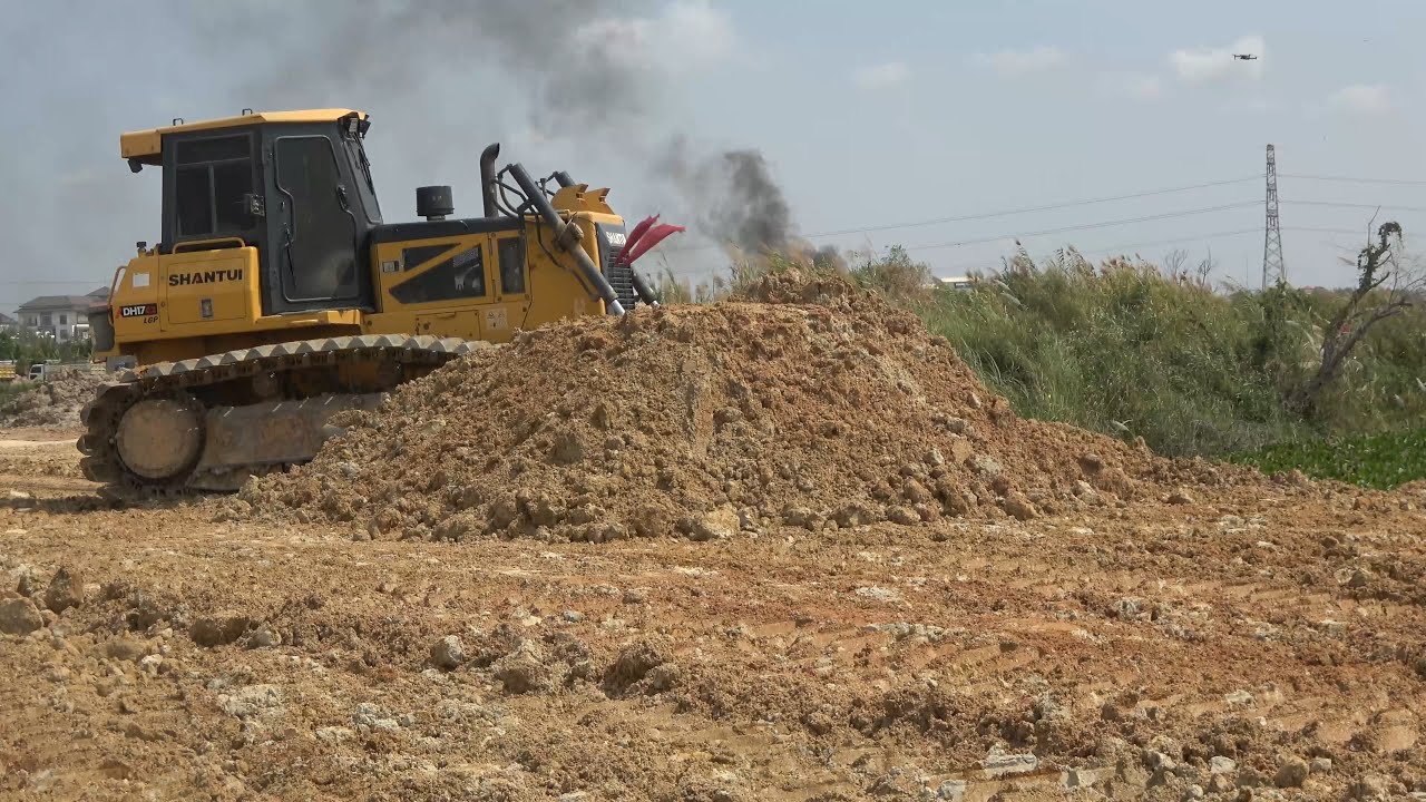 Bulldozer Shantui dh17c2, Dongfeng Dump Truck well operating at road ...