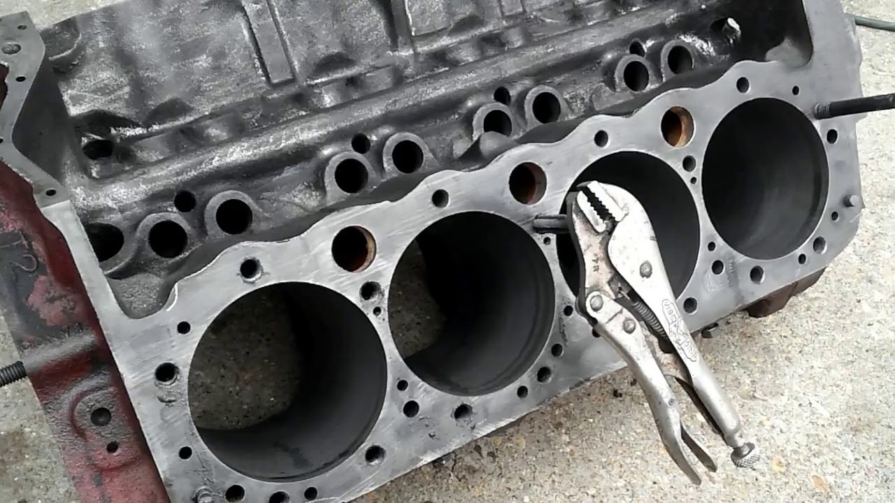 400 small block. Cleaning the bolt holes. And deburing the lifter ...