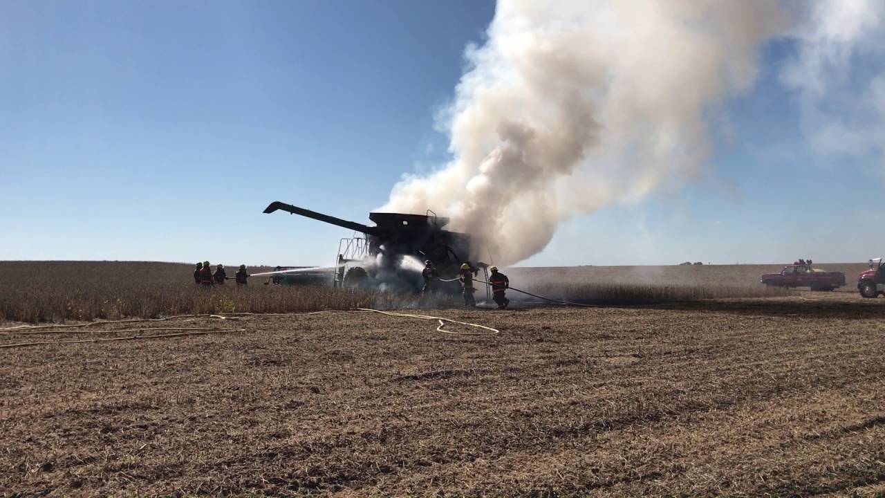 Firemen working on combine fire - YouTube