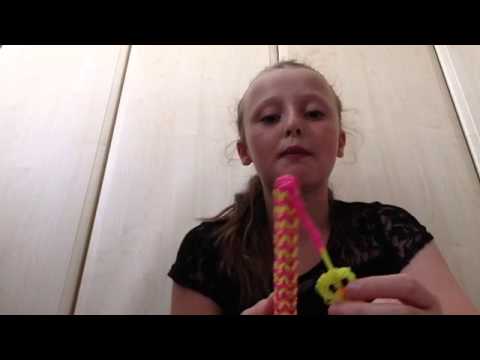 Pencil grip with a charm