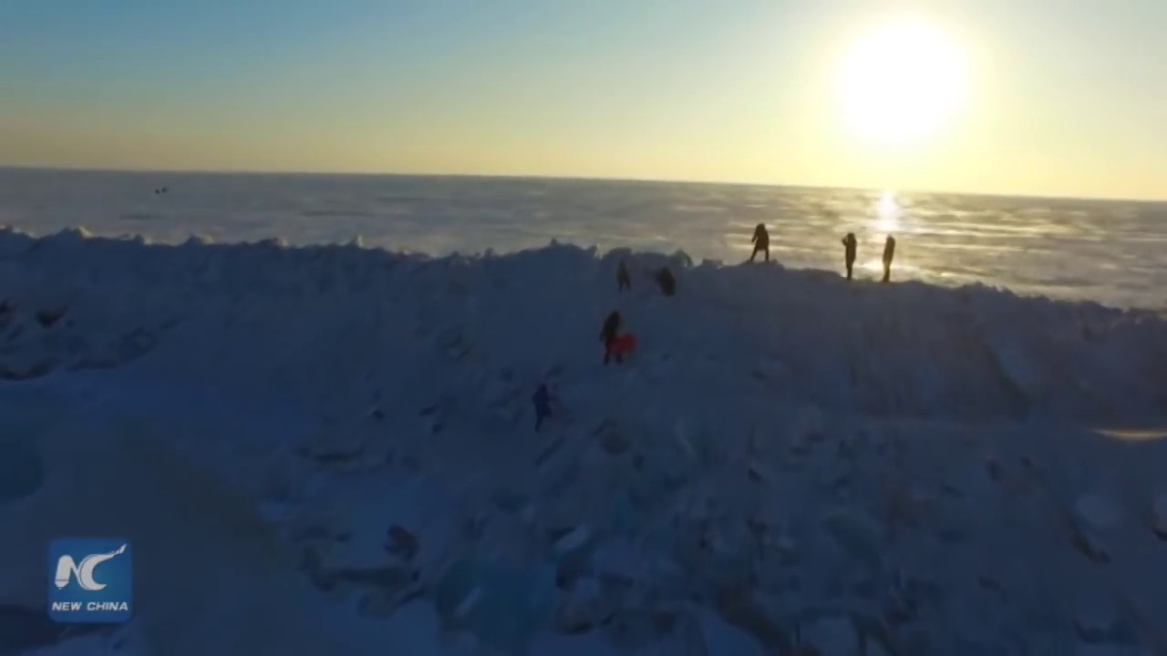 Giant wall of ice forms on China-Russia border lake - YouTube