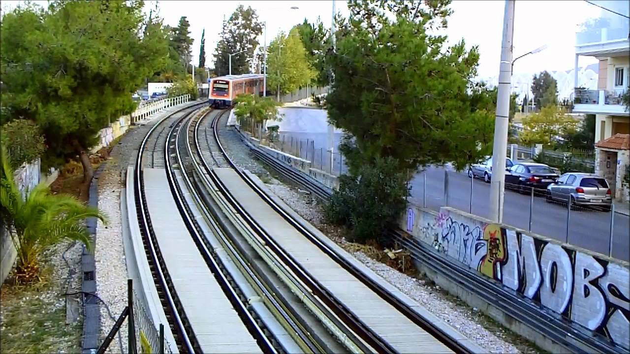 Greek Metro line 1 trains near Iraklio and Eirini stations - YouTube