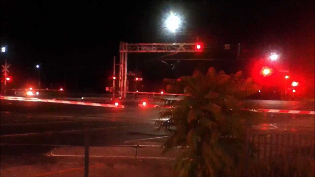 Railroad crossings with light rail at night at mather field road and ...