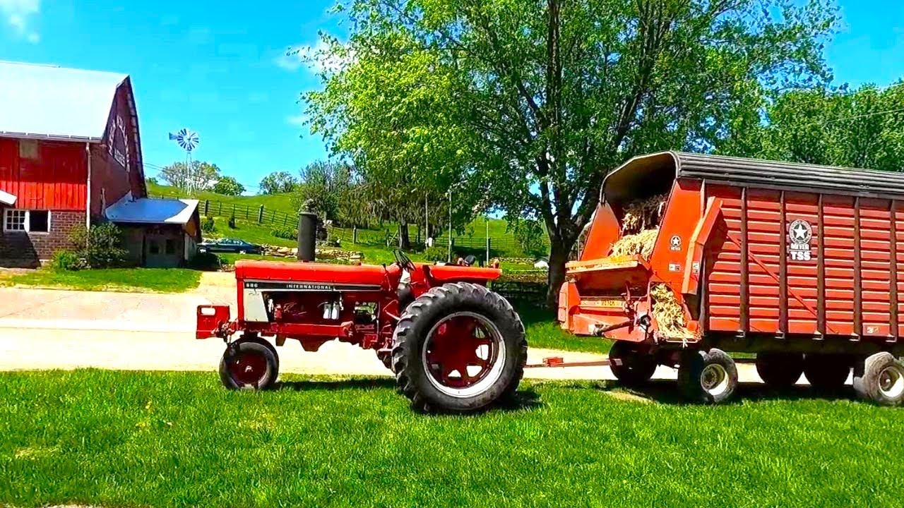 Red Power Hard at Work on the Farm Moving Bales and Chopper Boxes ...