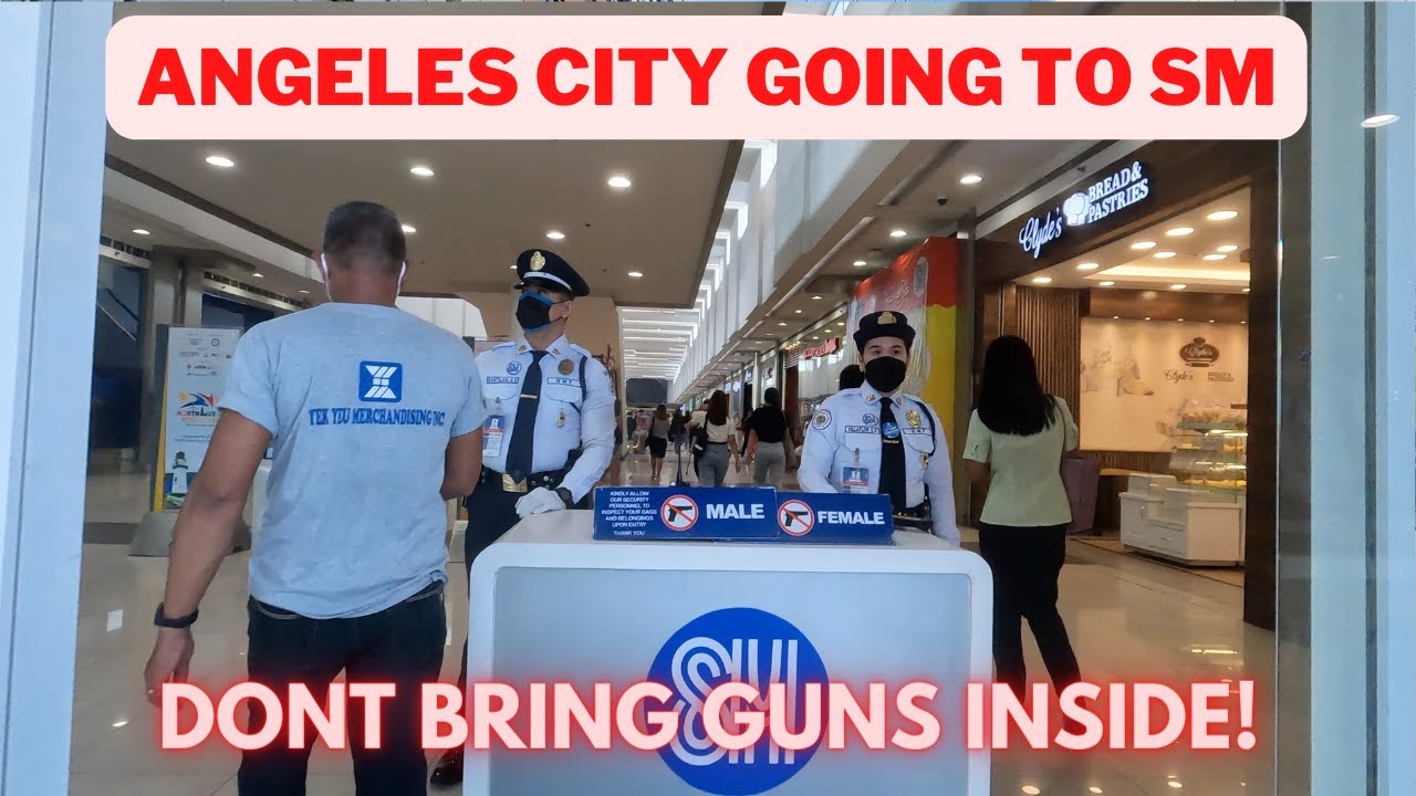 Friendship terminal to SM mall Clark. Sign say dont bring weapon inside ...