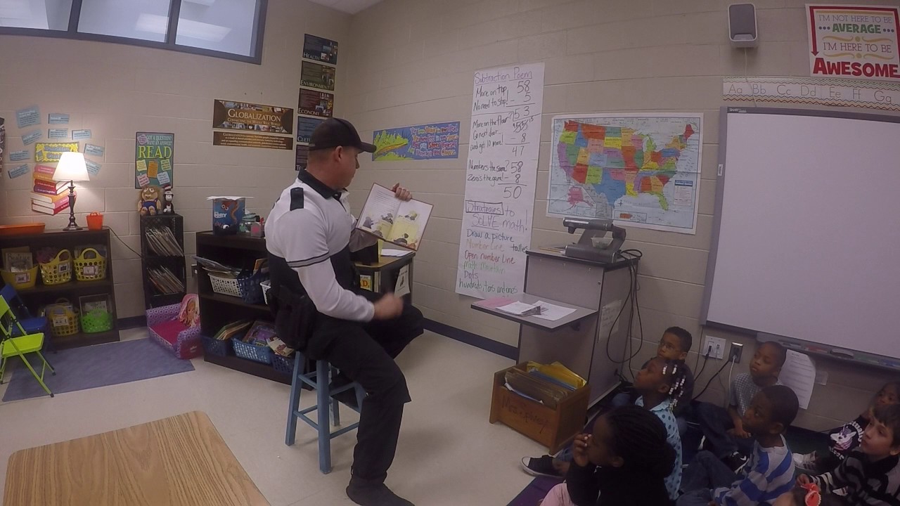 Deputy Knodel reads to the students at Boone Trail Elementary School ...